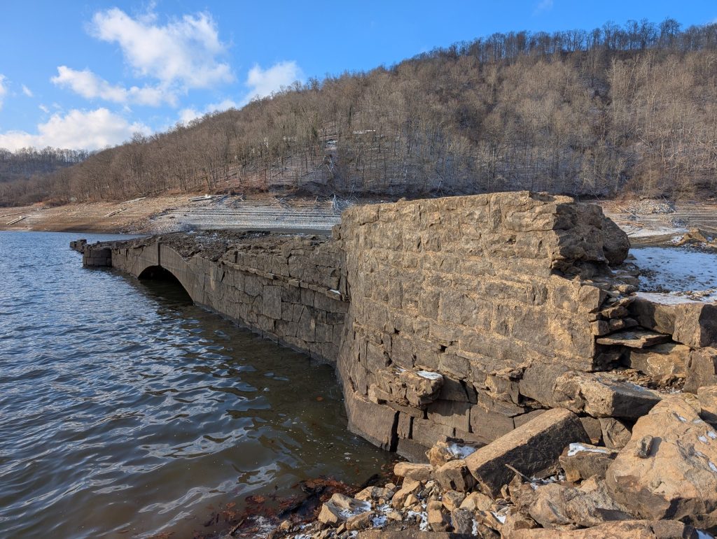 Great Crossings Bridge submerges back into Yough Lake after its moment ...